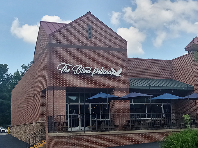The brick fortress of flavor that is The Blind Pelican stands proudly in Holly Springs, promising seafood treasures within its unassuming walls.