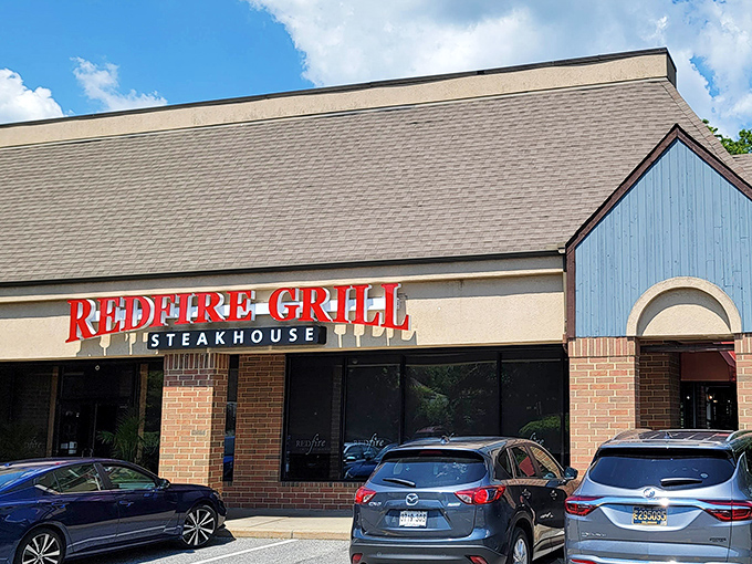 Redfire Grill's modest exterior hides culinary treasures within, like finding a Michelin star chef cooking in your neighbor's garage.