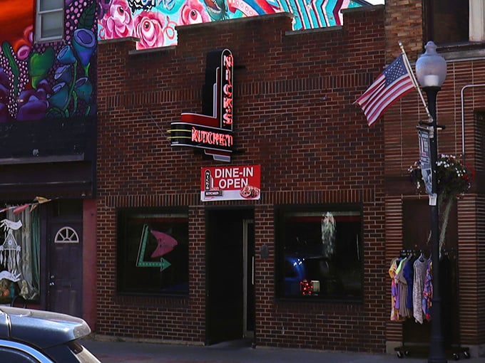 Downtown Huntington's culinary landmark announces itself with vintage neon confidence. Like finding a secret doorway to flavor paradise, this entrance promises Midwestern magic.
