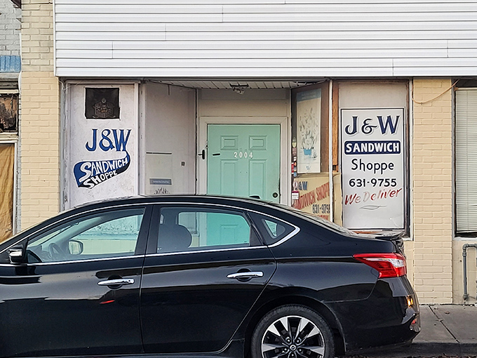 The mint-green door and classic signage of J&W Sandwich Shoppe stand as a humble portal to sandwich paradise in Norwood.