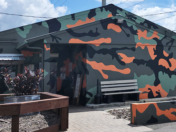 Military-inspired camouflage isn't hiding anything here&mdash;this tavern wants to be found. The outdoor bench invites you to take a breather before the flavor assault begins.