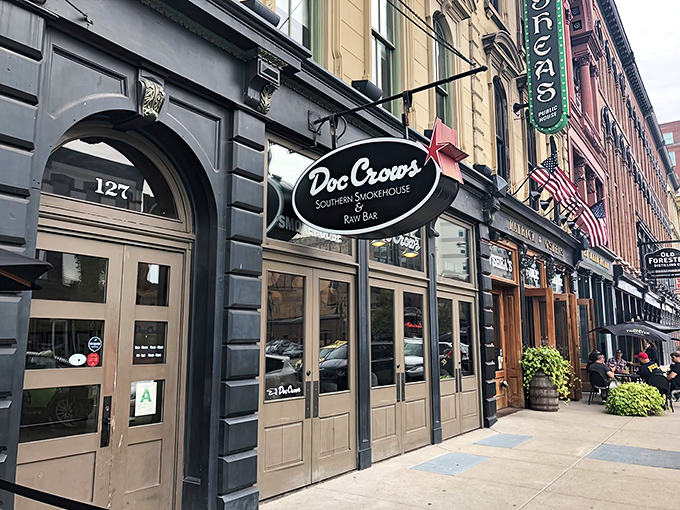 Historic charm meets Southern hospitality on Louisville's Whiskey Row. The black facade and elegant signage promise smoky delights within.