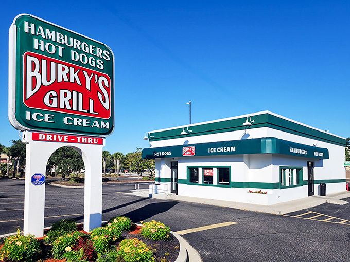The iconic green and white Burky's sign stands like a beacon of hope for hungry travelers&mdash;promising simple pleasures executed with surprising perfection.