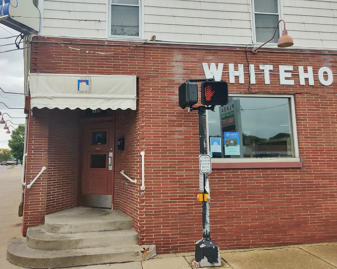 The brick facade of White House Chicken stands as a no-nonsense monument to fried poultry perfection in Barberton, where culinary legends are born without fancy frills.