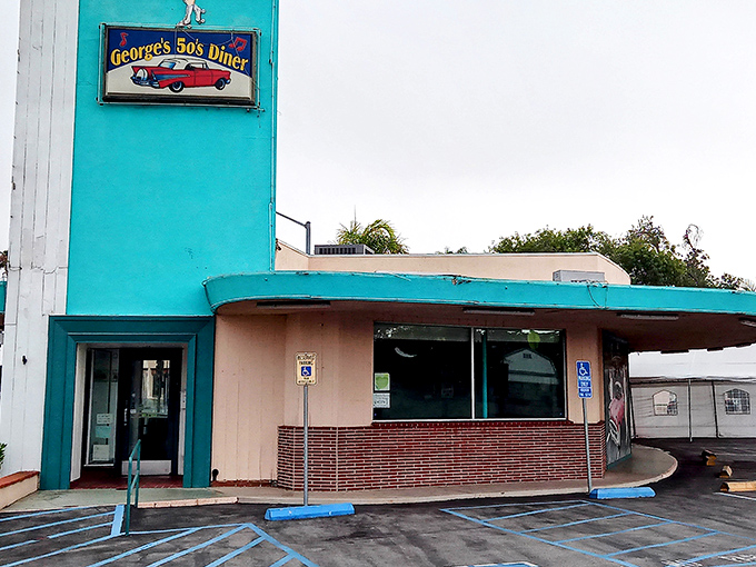 The turquoise beacon of George's 50's Diner stands out against the California sky, promising a time-traveling breakfast experience that Elvis himself would approve of.