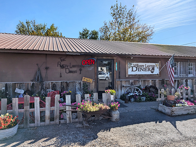 Morning sunshine illuminates this unassuming roadside treasure. The American flag and weathered wood speak volumes about heartland values.