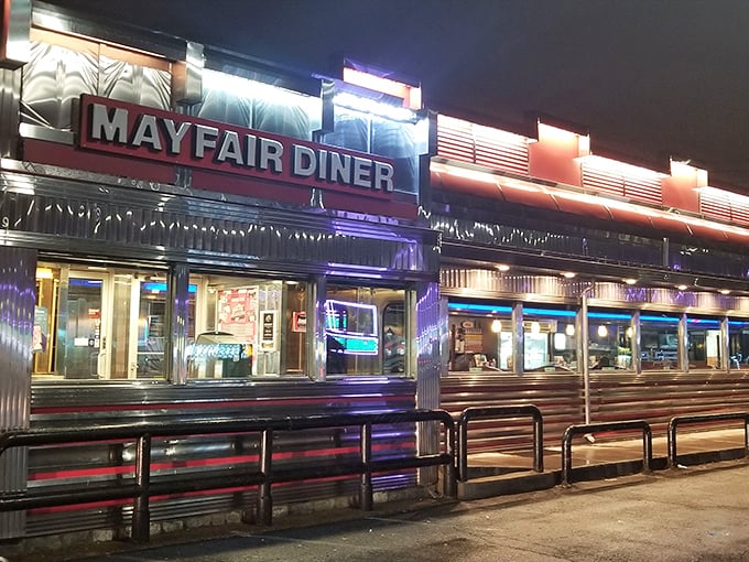 The neon glow of Mayfair Diner at night isn't just illumination&mdash;it's a beacon calling hungry Philadelphians home to comfort food paradise.