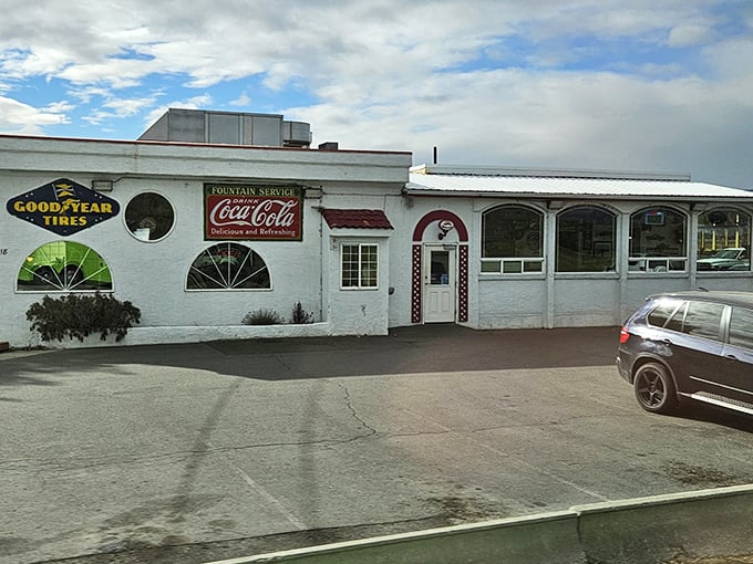 The classic white exterior with vintage Coca-Cola and Goodyear signs isn't just nostalgic decoration&mdash;it's a time portal disguised as a diner.