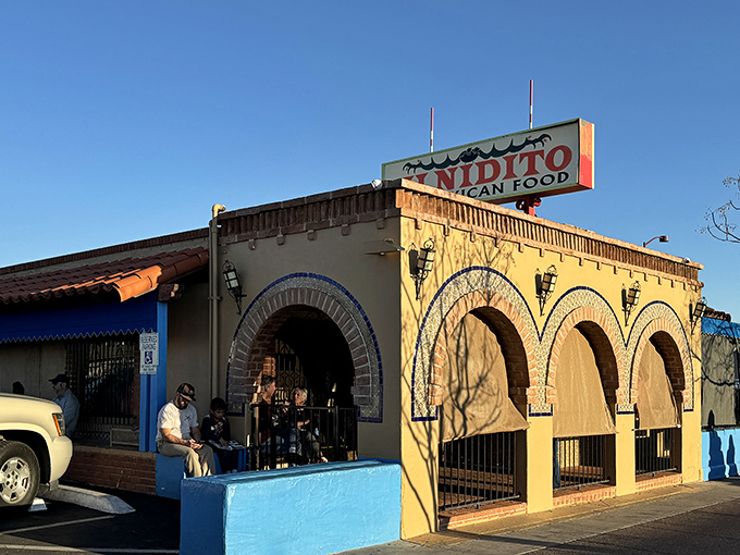 The iconic Mi Nidito exterior beckons with its cheerful yellow walls and distinctive arches&mdash;like a warm Mexican hug in architectural form.