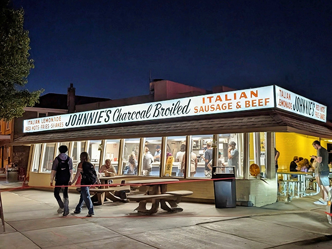 Nighttime at Johnnie's transforms this humble stand into a beacon of beef salvation. The glow from within promises delicious redemption for the hungry masses.