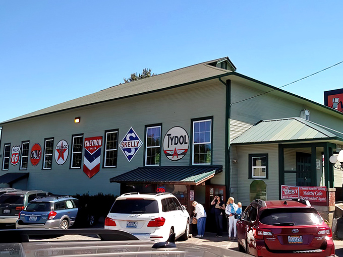 Vintage gas station signs adorn the exterior, a quirky prelude to the comfort food paradise within. Who knew breakfast nirvana hid behind Texaco memorabilia?