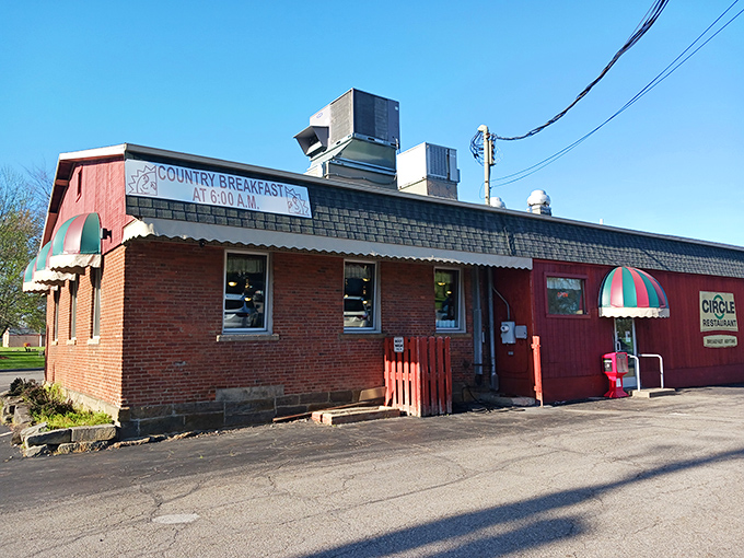 The bright red exterior of Circle Restaurant stands like a beacon of breakfast hope, proudly declaring "BREAKFAST ANYTIME" &ndash; words that warm the soul.
