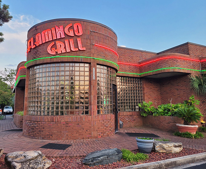The curved glass block entrance of Flamingo Grill isn't just retro-cool architecture&mdash;it's a time portal to when dining out was an event worth dressing up for.
