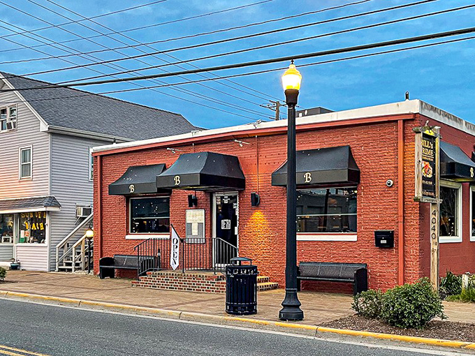 Classic black awnings frame this unassuming seafood sanctuary, where locals gather for what might be the Eastern Shore's worst-kept delicious secret.