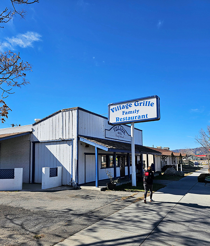 From another angle, the Village Grille's classic roadside charm shines under California's brilliant blue sky &ndash; a time capsule of American dining waiting to be discovered.