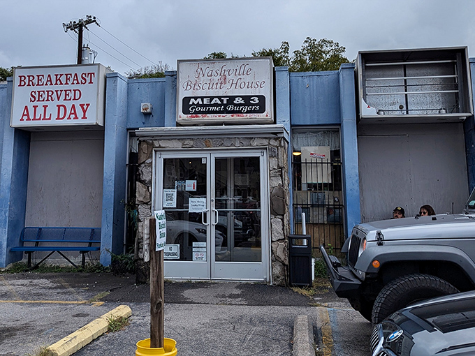The blue facade and "BREAKFAST SERVED ALL DAY" sign aren't just words&mdash;they're a promise that morning's greatest hits are always on tour at Nashville Biscuit House.