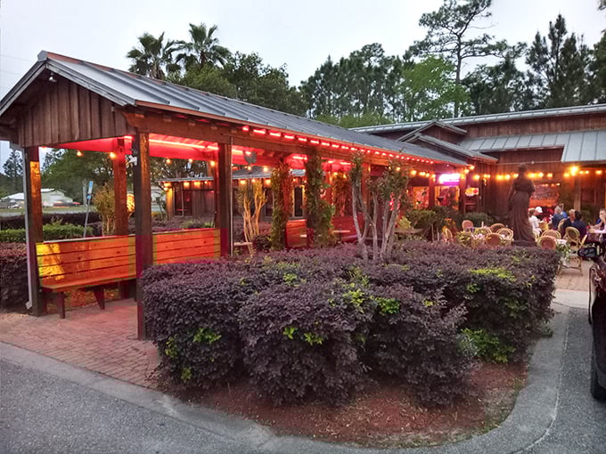 The warm glow of Louis Louis beckons like a lighthouse for hungry souls, its wooden exterior and string lights promising refuge from ordinary dining experiences.