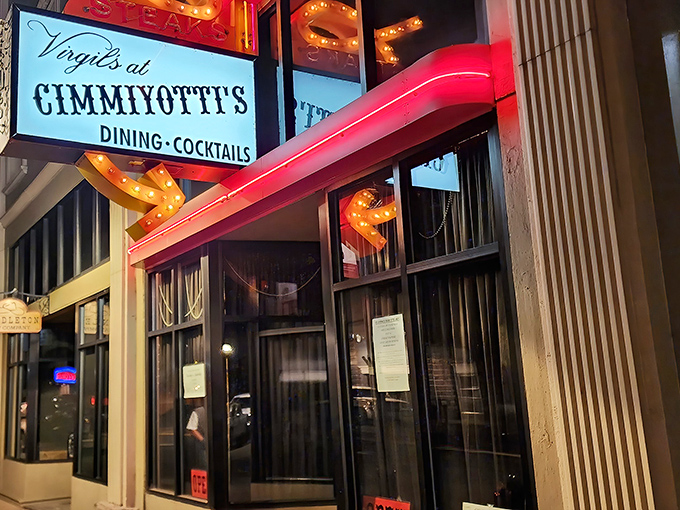 The iconic neon sign beckons hungry travelers like a lighthouse for steak lovers. Downtown Pendleton's crown jewel glows with promise as evening approaches.