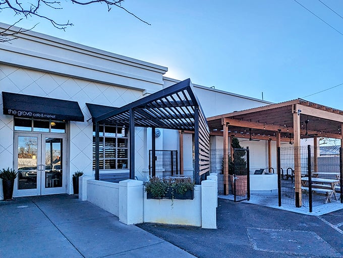The Grove's crisp white exterior with wooden accents feels like stumbling upon a secret garden oasis in Albuquerque's urban landscape.