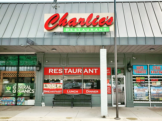 The unassuming storefront that houses culinary magic. Charlie's red script sign promises comfort food treasures within this Madison Heights strip mall gem.