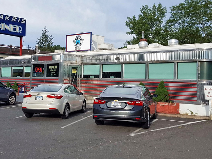 The gleaming stainless steel exterior of Makris Diner stands like a time capsule on the Berlin Turnpike, promising comfort food and nostalgia in equal measure.