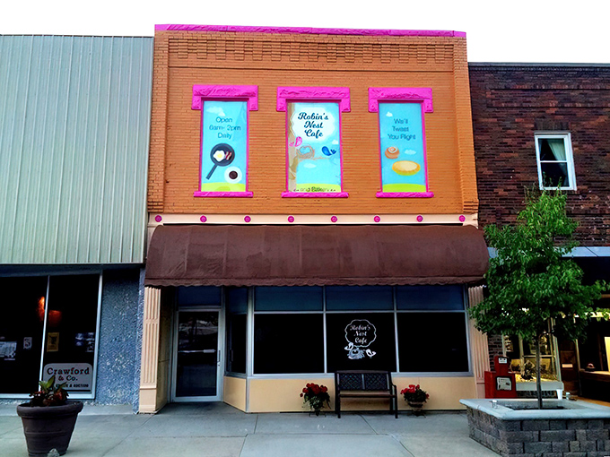 Bright pink window displays announce Robin's Nest Caf&eacute; like a cheerful billboard for breakfast bliss.