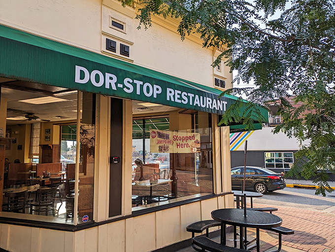 The iconic green awning of Dor-Stop Restaurant beckons hungry Pittsburghers like a breakfast lighthouse guiding ships to shore.