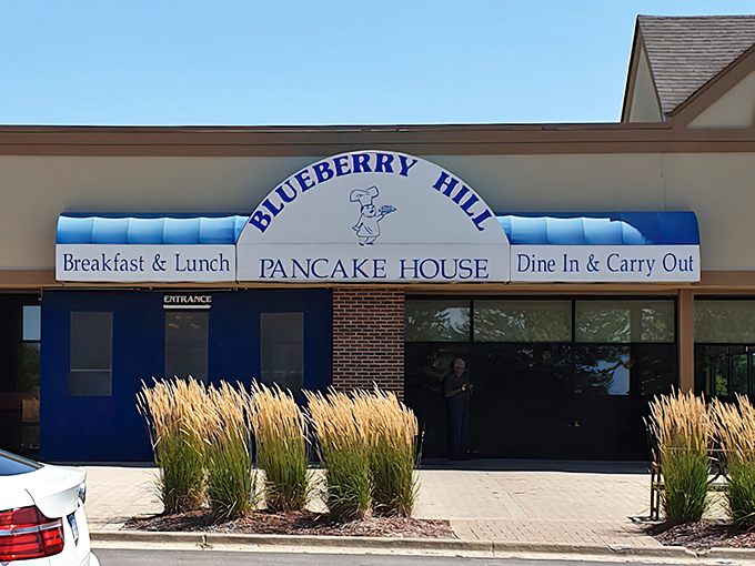The blue awning of Blueberry Hill beckons like a breakfast lighthouse guiding hungry souls to the promised land of perfect omelets.