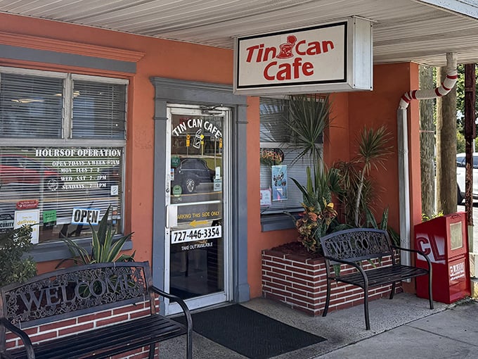 The cheerful coral exterior of Tin Can Cafe beckons like a friendly neighbor inviting you over for breakfast. Those wrought-iron benches have witnessed countless coffee conversations.
