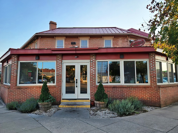 The brick facade of Old Canal Smoke House welcomes hungry visitors like a beacon of barbecue hope in downtown Chillicothe.