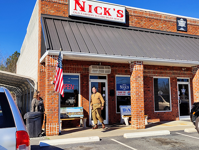 The brick fortress of flavor that is Nick's Old Fashioned Hamburger House stands proudly in Lexington, complete with American flag and that iconic red sign.