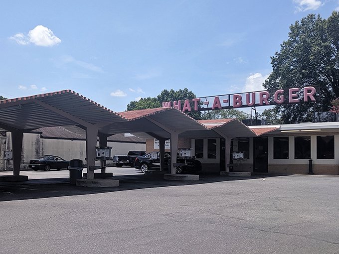 The zigzag roofline isn't just architectural flair—it's a beacon calling hungry travelers home to burger paradise since before Instagram could make food famous.