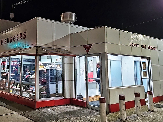 Night or day, the neon-bright Telway welcomes hungry patrons with its "CARRY OUT SERVICE" sign promising delicious relief for rumbling stomachs.