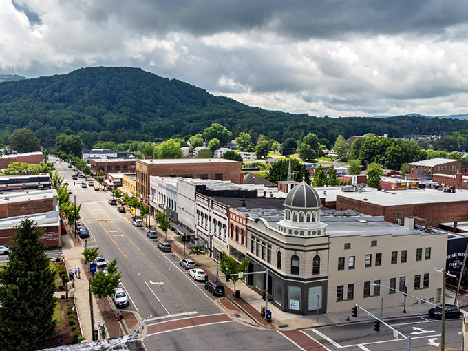 Downtown Marion unfolds beneath misty Blue Ridge mountains, where historic brick buildings and modern affordability create the perfect retirement backdrop.