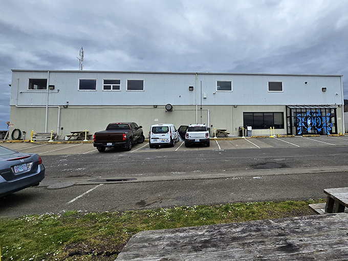 The unassuming exterior of The Fish Peddler at Pacific Oyster&mdash;proof that culinary treasures often hide in plain sight along Oregon's coast.