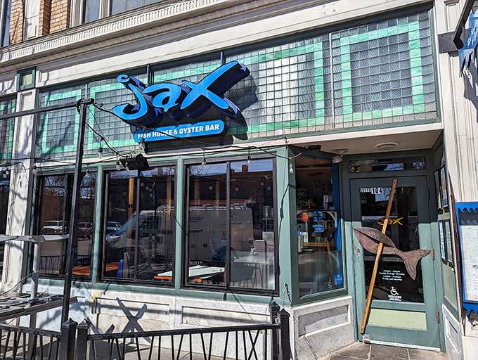 As dusk falls, the neon-blue Jax sign glows with promise, transforming this corner of Old Town into a coastal getaway for mountain dwellers.