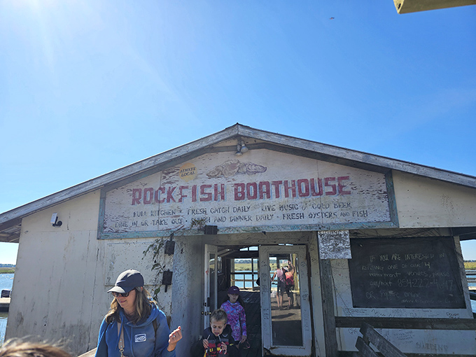 The weathered sign says "Rock Fish Boathouse," but locals know this humble shack houses seafood treasures that would make Neptune himself jealous.