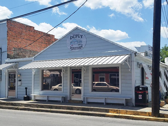 Dupuy's iconic blue exterior with its distinctive white shutters stands as a beacon of culinary promise on Abbeville's quiet streets. Southern charm meets seafood paradise!