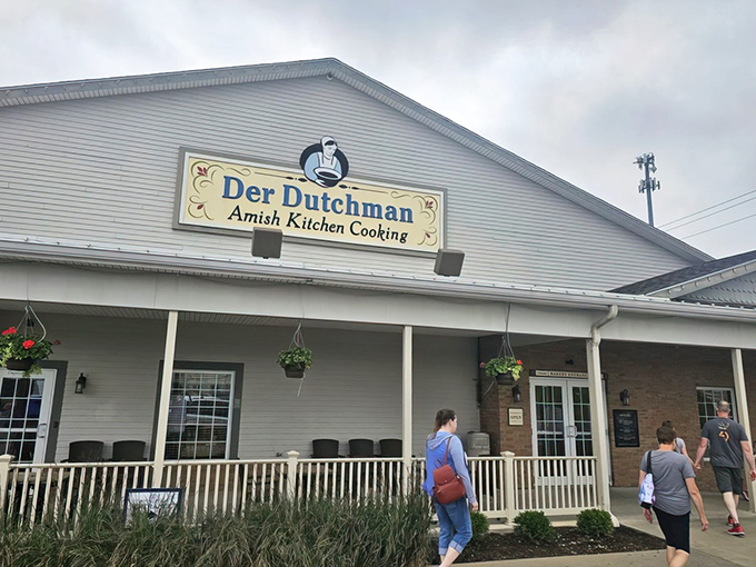 A second view of Der Dutchman's inviting exterior, where rocking chairs patiently wait for diners who need a moment to recover from their delicious food comas.