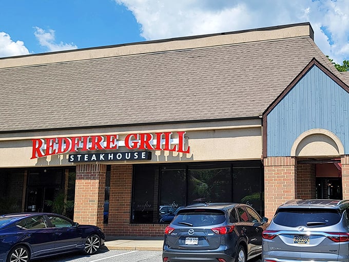 Redfire Grill's modest exterior hides culinary treasures within, like finding a Michelin star chef cooking in your neighbor's garage.
