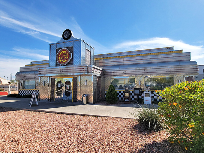 Chrome-clad time travel! Nana Dee's shimmering exterior stands against the Arizona sky like a beacon calling hungry travelers to breakfast paradise.