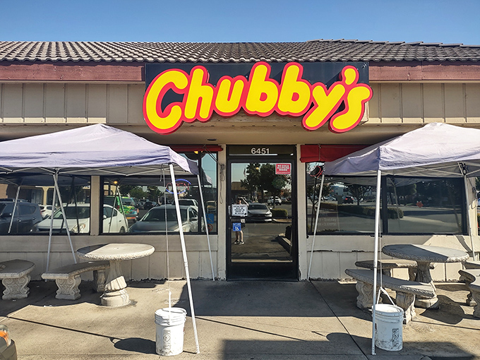 The bright yellow and red Chubby's sign beckons like a culinary lighthouse on Blackstone Avenue, promising comfort food salvation to hungry Fresno travelers.