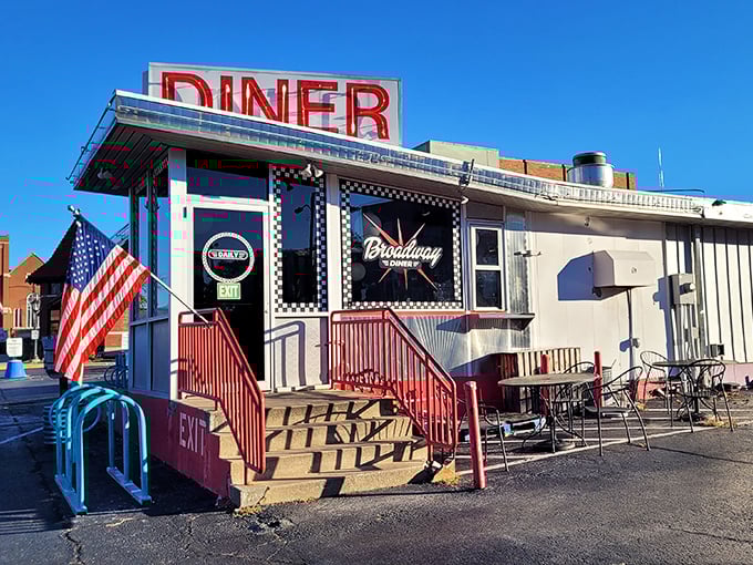 The classic red "DINER" sign beckons like a lighthouse for the breakfast-starved. American flag included—because pancakes are patriotic.