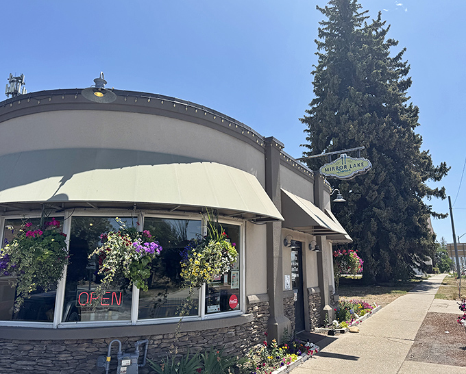 The curved stone facade and vibrant hanging flower baskets make Mirror Lake Diner the most inviting pit stop on your Uinta Mountains adventure.