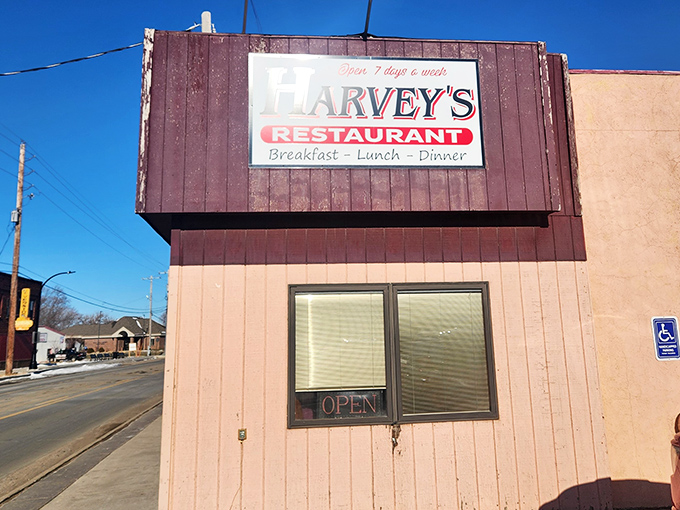 The pink-and-burgundy exterior of Harvey's stands like a culinary lighthouse on Gordon Drive, beckoning hungry travelers with promises of home-cooked comfort.