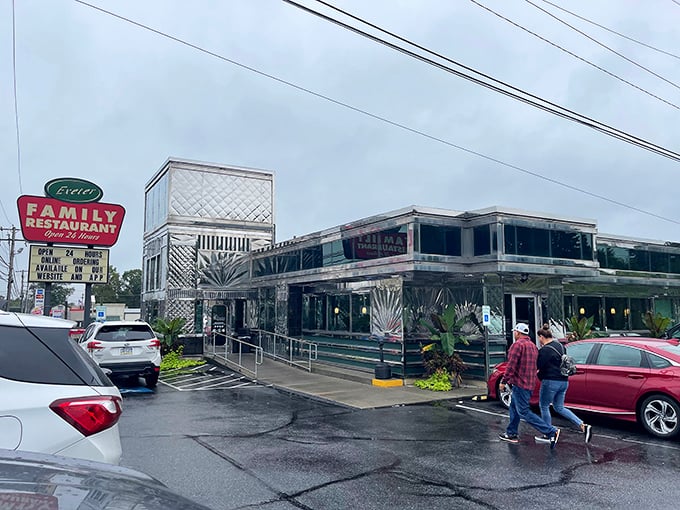 The chrome-clad exterior of Exeter Family Restaurant gleams like a time capsule from the golden age of American diners, beckoning hungry travelers with its vintage charm.