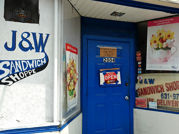 The bright blue door beckons like a portal to sandwich paradise, promising delicious secrets behind its unassuming facade.