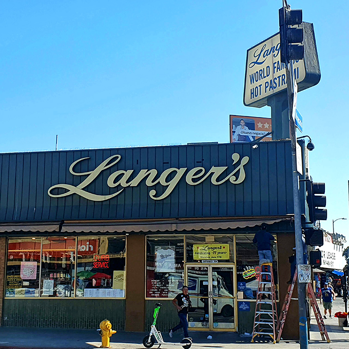 The iconic blue exterior of Langer's, where that "World Famous Hot Pastrami" sign has been beckoning sandwich pilgrims for generations.