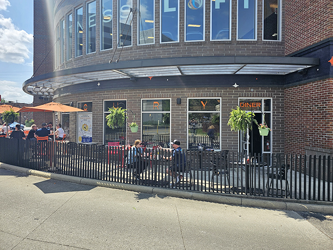 Outdoor dining at The Mercury offers a front-row seat to Columbus street life, where hanging plants and good conversation flourish equally well.