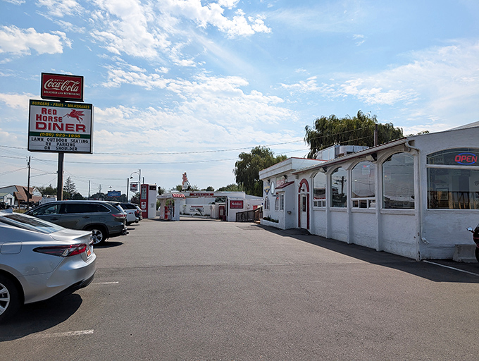 The classic roadside silhouette of Red Horse Diner stands proudly against Washington's big sky, promising comfort food and nostalgia in equal measure.